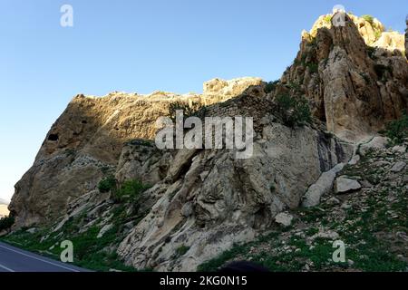 An aerial view of Cudi Gabar mountains surrounded by water under blue ...