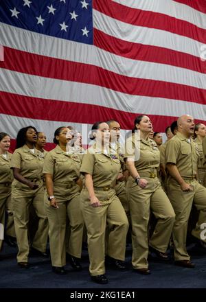 US Navy Newly pinned chief petty officers (CPOs) stand in formation ...