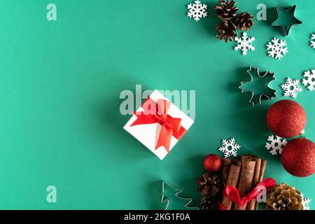 black gift box, balls, red Christmas decorations on the dark wooden ...