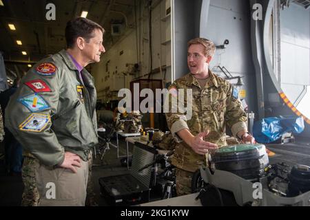 Rear Adm. Greg Huffman, right, commander, Carrier Strike Group (CSG) 12 ...