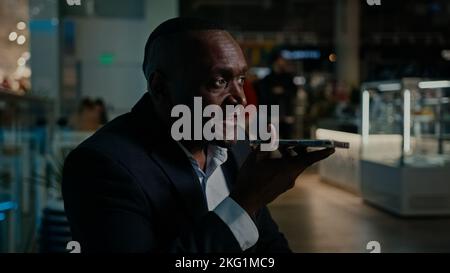 Senior man recording voice message when enjoying backyard view from ...