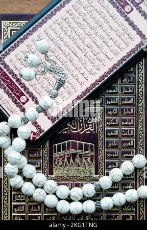 Digital Quran on a tablet and traditional Holy Quran on paper Stock ...