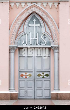The JHS monogram of the name of Jesus on a closerd church door. Danang ...