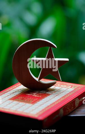 Holy Quran with islam crescent and star. Islamic symbol Stock Photo - Alamy
