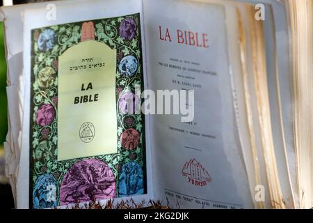 Old Torah book with the the five books of Moses. Cover with a menorah ...