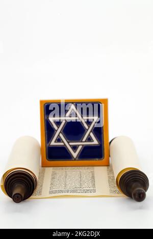 Star of David and small Torah scrolls. Symbol of Jewish identity and ...