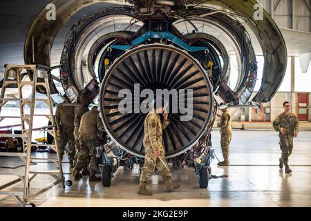 U.S. Airmen with the 660th Aircraft Maintenance Squadron swap an engine ...