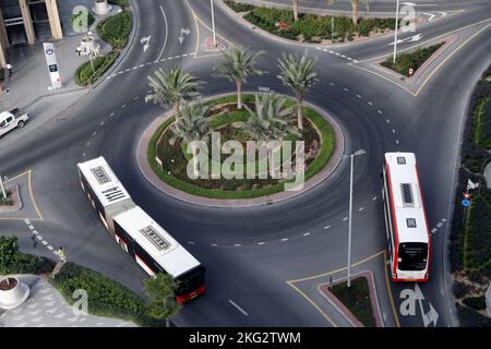Street Scene With Bus Turning Round a Roundabout. United Arab Emirates ...