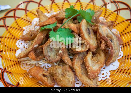 A delicious Chinese dish, fried seven-inch fatty intestines Stock Photo ...