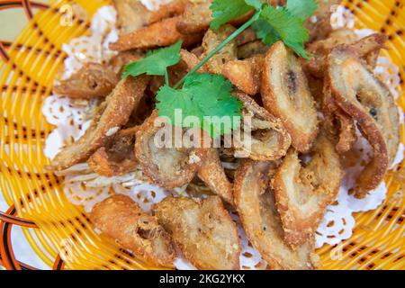 A delicious Chinese dish, fried seven-inch fatty intestines Stock Photo ...