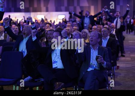 Conference attendees celebrate as they watch the England v Iran FIFA ...