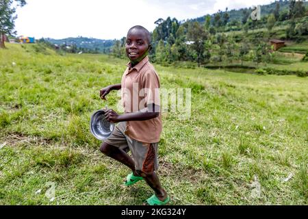 Schoolboy running, Rutsiro district, Rwanda Stock Photo - Alamy