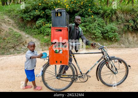 Man pushing a bike loaded with crates in western Rwanda Stock Photo - Alamy