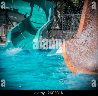 Details of blue and orange slides in an aqua park Stock Photo - Alamy