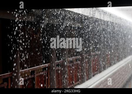 Rain drops falling over roof during monsoon. Rainy day and rainy season ...