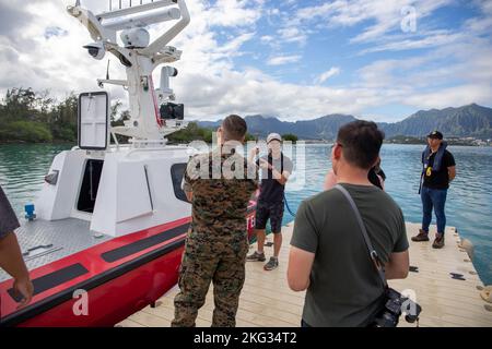 NG Chee Wee, center, ST Engineering, delivers a demonstration brief to ...