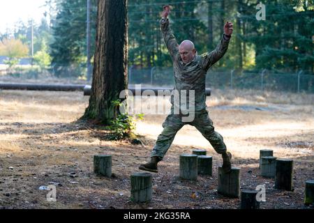 Sgt. 1st Class Cory Fowler from Madigan Army Medical Center, climbs to ...