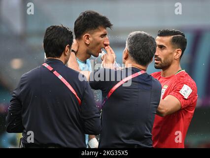 Iran goalkeeper Alireza Beiranvand receives treatment for an injury ...
