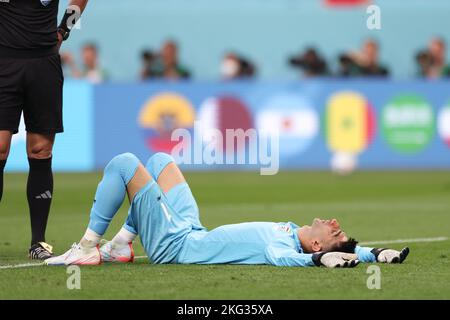 Iran goalkeeper Alireza Beiranvand reacts after picking up an injury ...