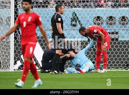 Iran goalkeeper Alireza Beiranvand receives treatment for an injury ...