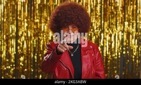 Woman smiling excitedly, pointing to camera choosing lucky lottery ...
