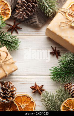 Christmas decoration with presents making a frame on a white wooden ...