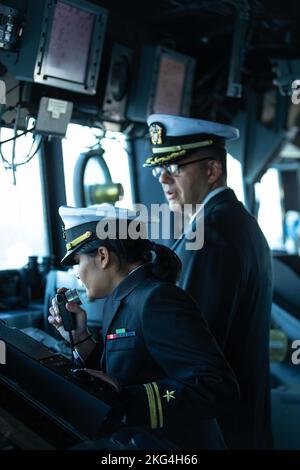 Capt. Simon McKeon, commanding officer, USS Normany, right, and Ens ...