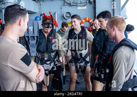 Search and rescue swimmers aboard the amphibious command ship USS Blue ...