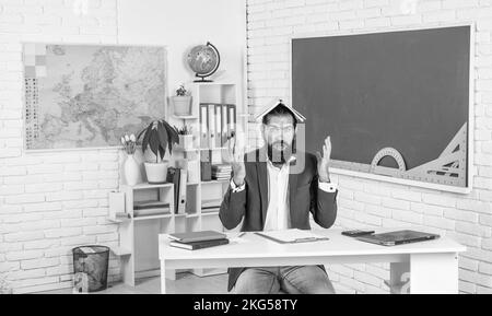 shocked bearded man overworked in school while studying, education ...