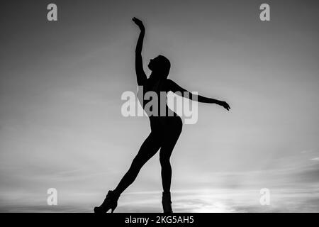 Set yourself free. Girl silhouette on evening sky. Free dance. My ...
