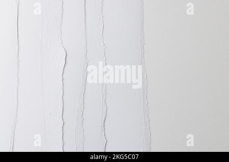 Ripped up pieces of white paper with copy space on white background ...