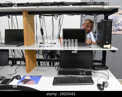 Jonathan Poe, a computer network technician IV, works in the computer ...
