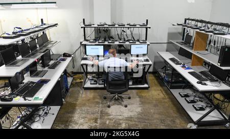 Jonathan Poe, a computer network technician IV, works in the computer ...