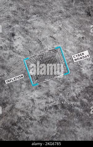 Inflation vs Cyber Monday conceptual image with empty shopping basket ...