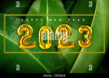2023 with a green leaves background. Happy New Year 2023 Stock Photo ...