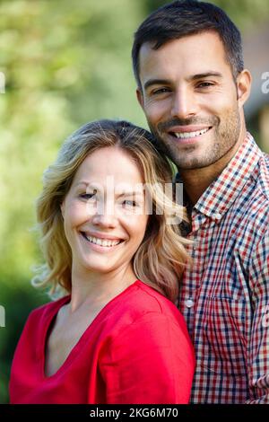 Portrait of young lovely couple hugging indoor eve 25 December. Lovers ...