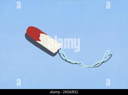 Tampon with string on blue background Stock Photo - Alamy