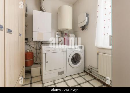 Boiler room of an apartment building with pipes and metering devices. A ...