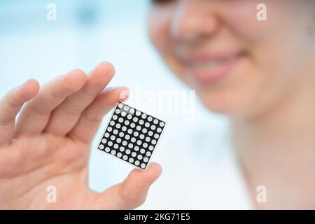 CPU crystal for using laptop and tablets in the hands of a young woman ...