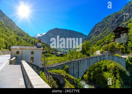 Ancient stone bridge over the moutnain river in Swiss Alps, Stal Stock ...