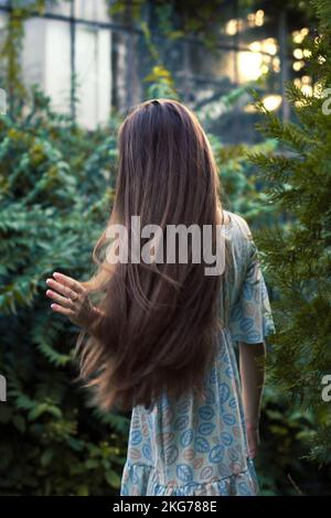 Photo of pretty charming young lady wear red clothes arms pockets empty ...