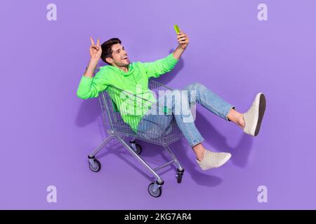 Happy rider man showing cellphone while posing with his bicycle ...