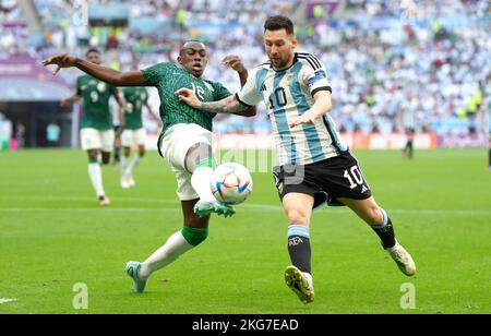 Saudi Arabia's Saud Abdulhamid, left, argues with referee Adham ...