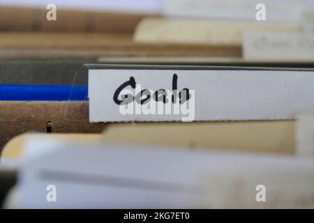 The office files and documents labeled as "goals Stock Photo - Alamy