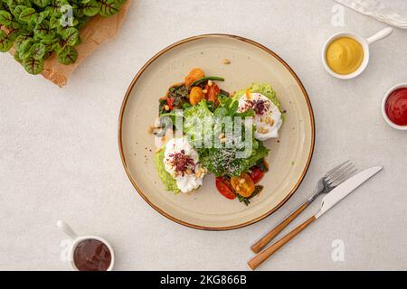 Portion of avocado toast with poached egg Stock Photo - Alamy