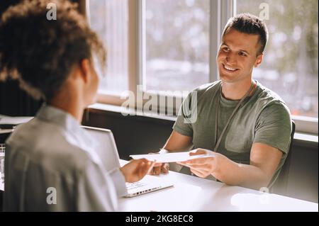 Office lady handing a document Stock Photo - Alamy