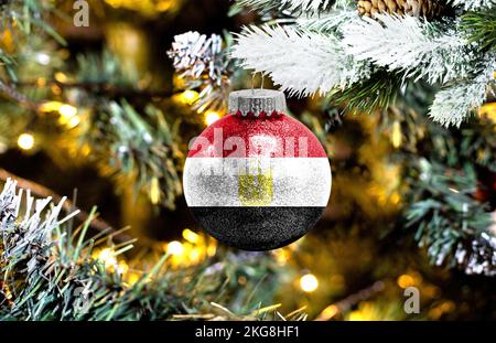 New Year's glass ball with the flag of Malta against a colorful ...