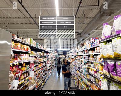 Shoppers in the Ethnic foods aisle in Whole Foods Brooklyn NYC Stock ...