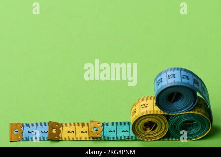 Tape measures of cyan, blue, yellow colors placed in pyramid Stock ...