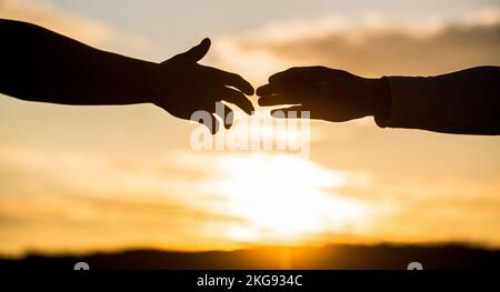 Handshake hand, arm on salvation. Close up help hand. Two hands, helping arm of a friend ...
